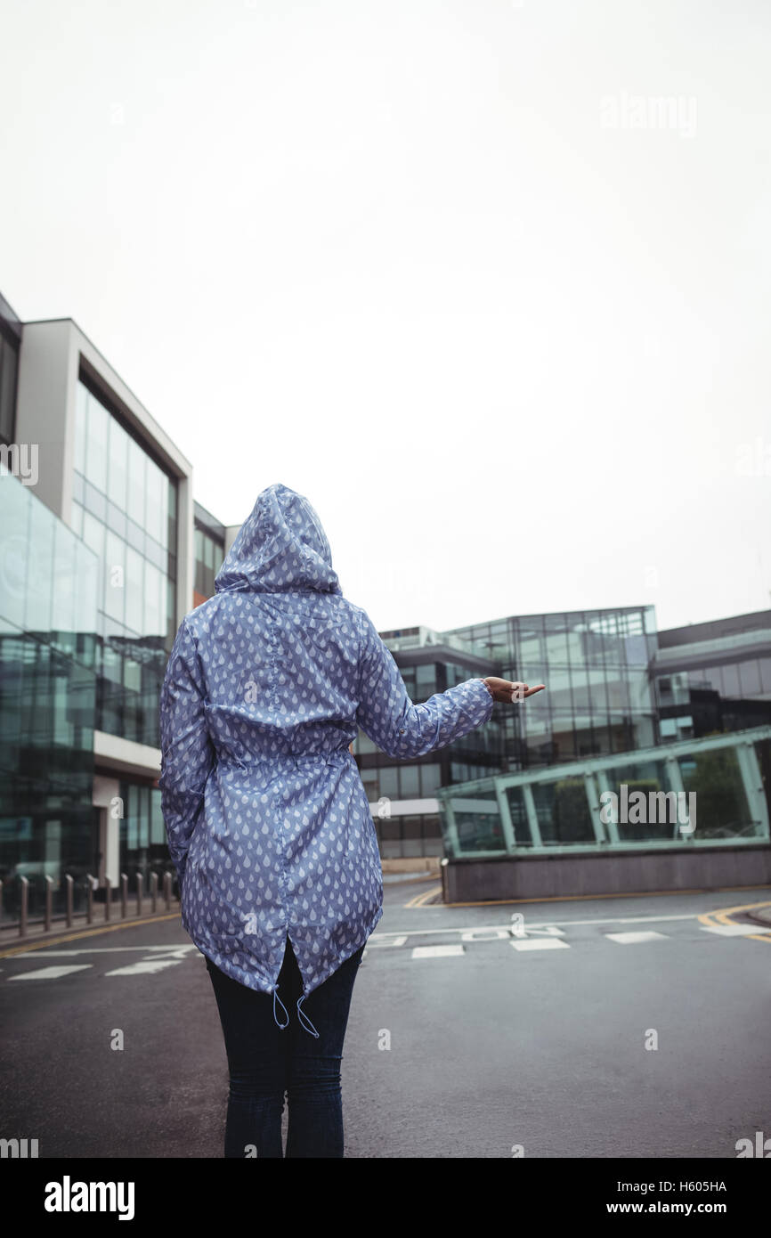 Rear view of woman standing on street Stock Photo - Alamy