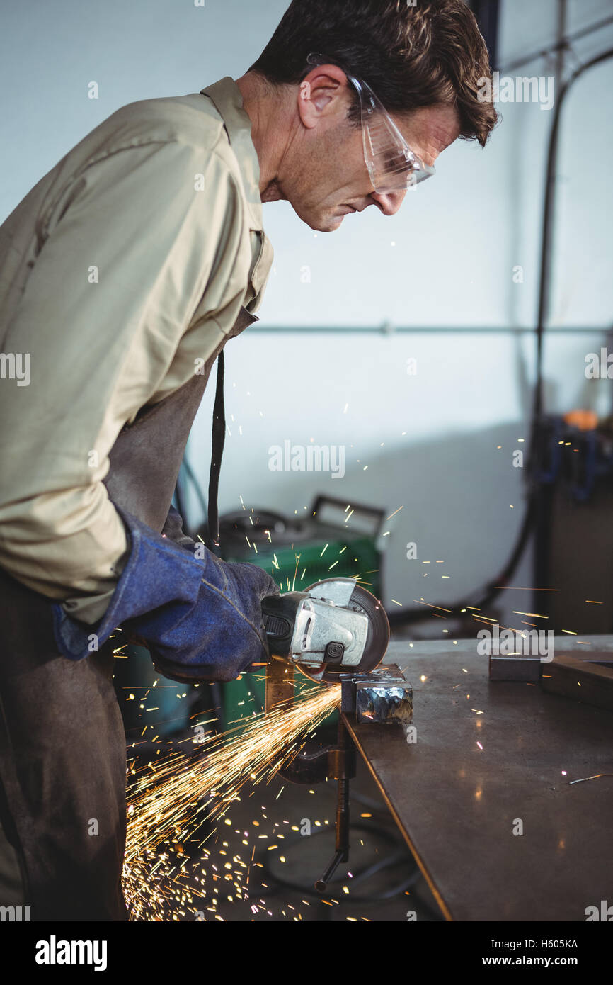 Welder working at work shop Stock Photo - Alamy