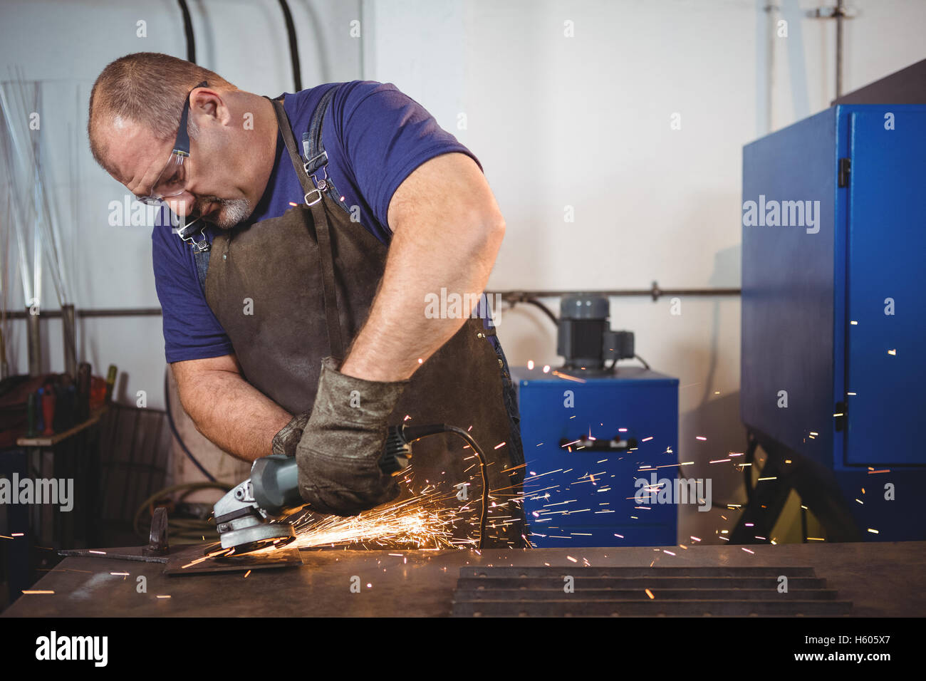 Welder working at work shop Stock Photo - Alamy