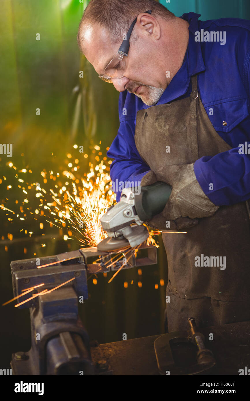 Welder working at work shop Stock Photo - Alamy