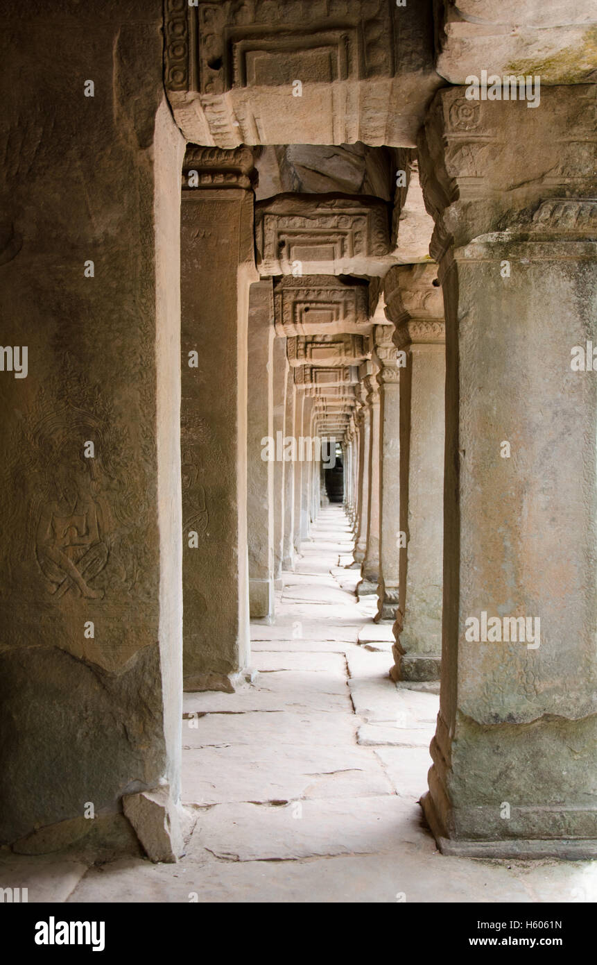 Intricate carved stone corridors in the Temples of Angkor, Cambodia ...
