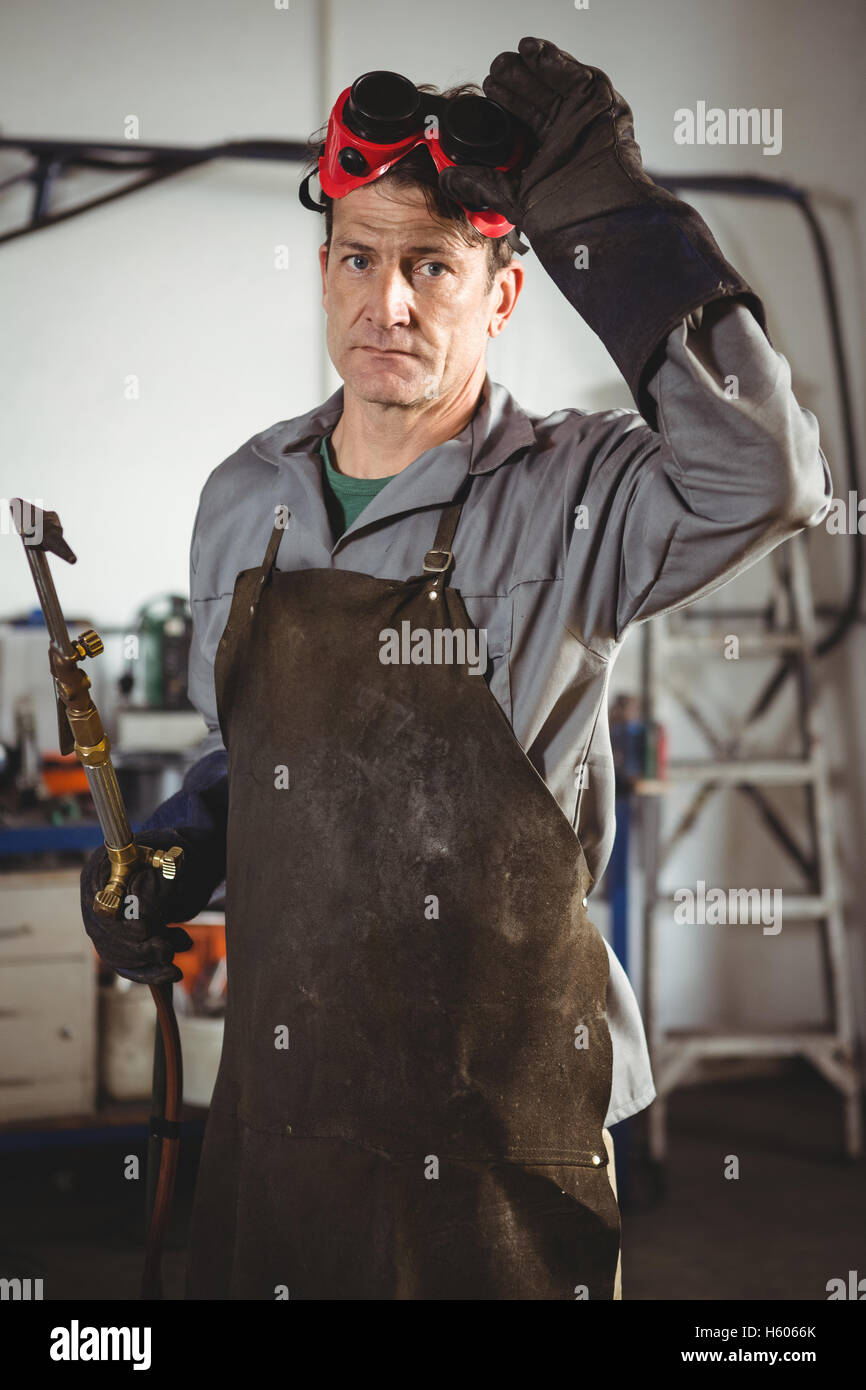 Portrait of welder standing in workshop Stock Photo - Alamy