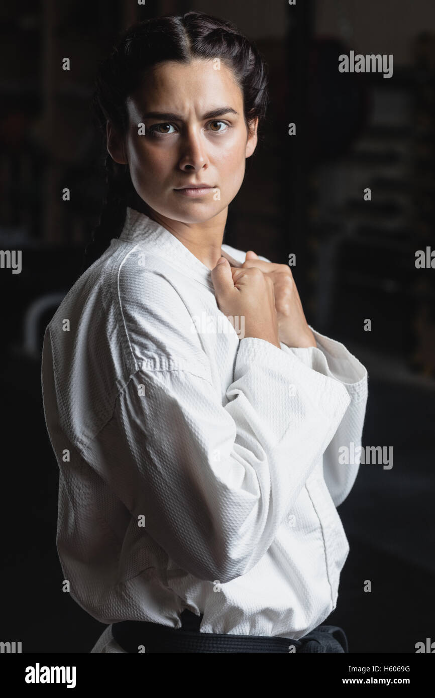 Woman practicing karate in fitness studio Stock Photo - Alamy