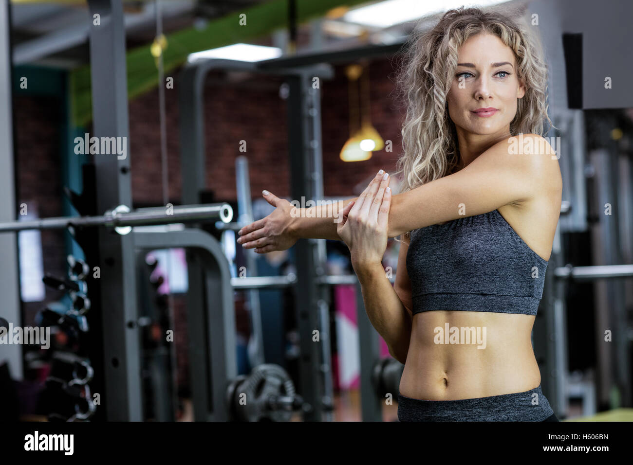 Beautiful woman performing stretching exercise Stock Photo - Alamy