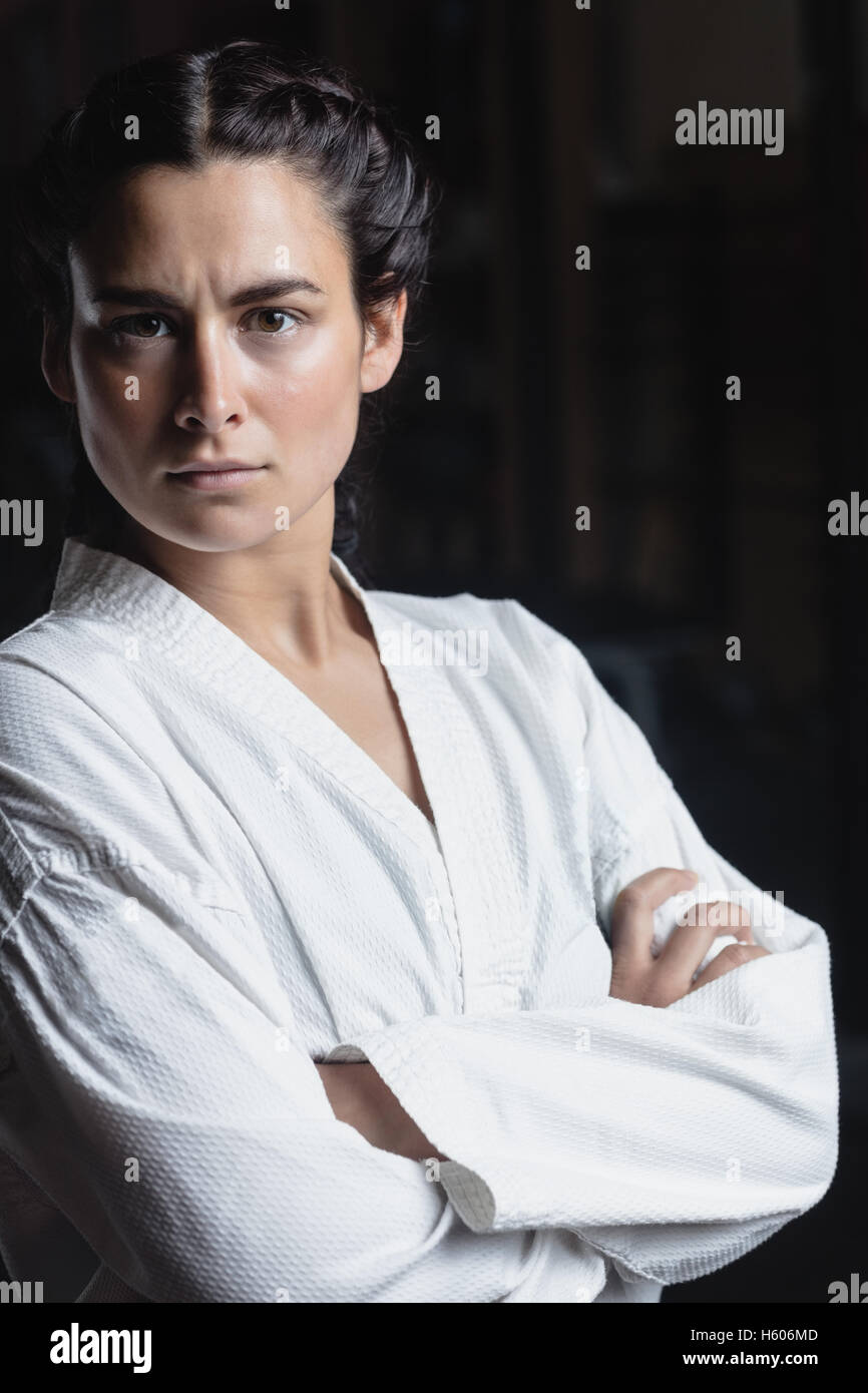 Portrait of woman standing with arm crossed Stock Photo - Alamy