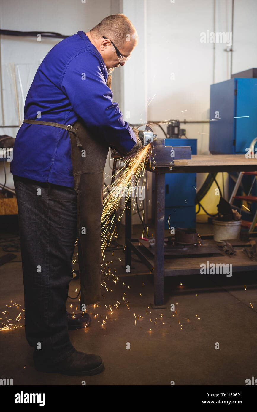 Welder working at work shop Stock Photo - Alamy