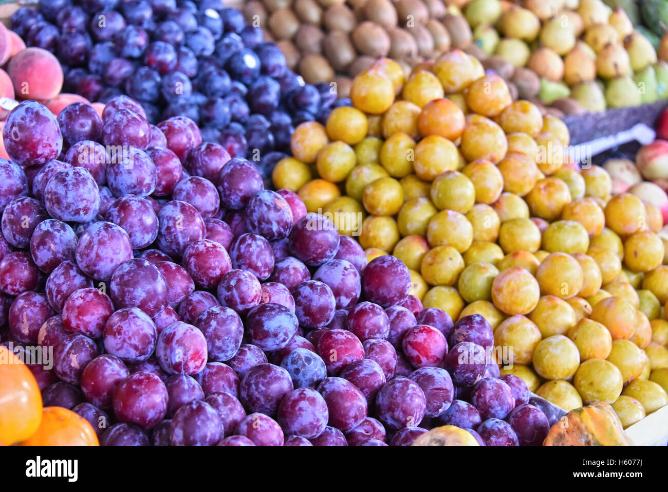 Variety of fresh ripe fruits on street market stall Stock Photo - Alamy