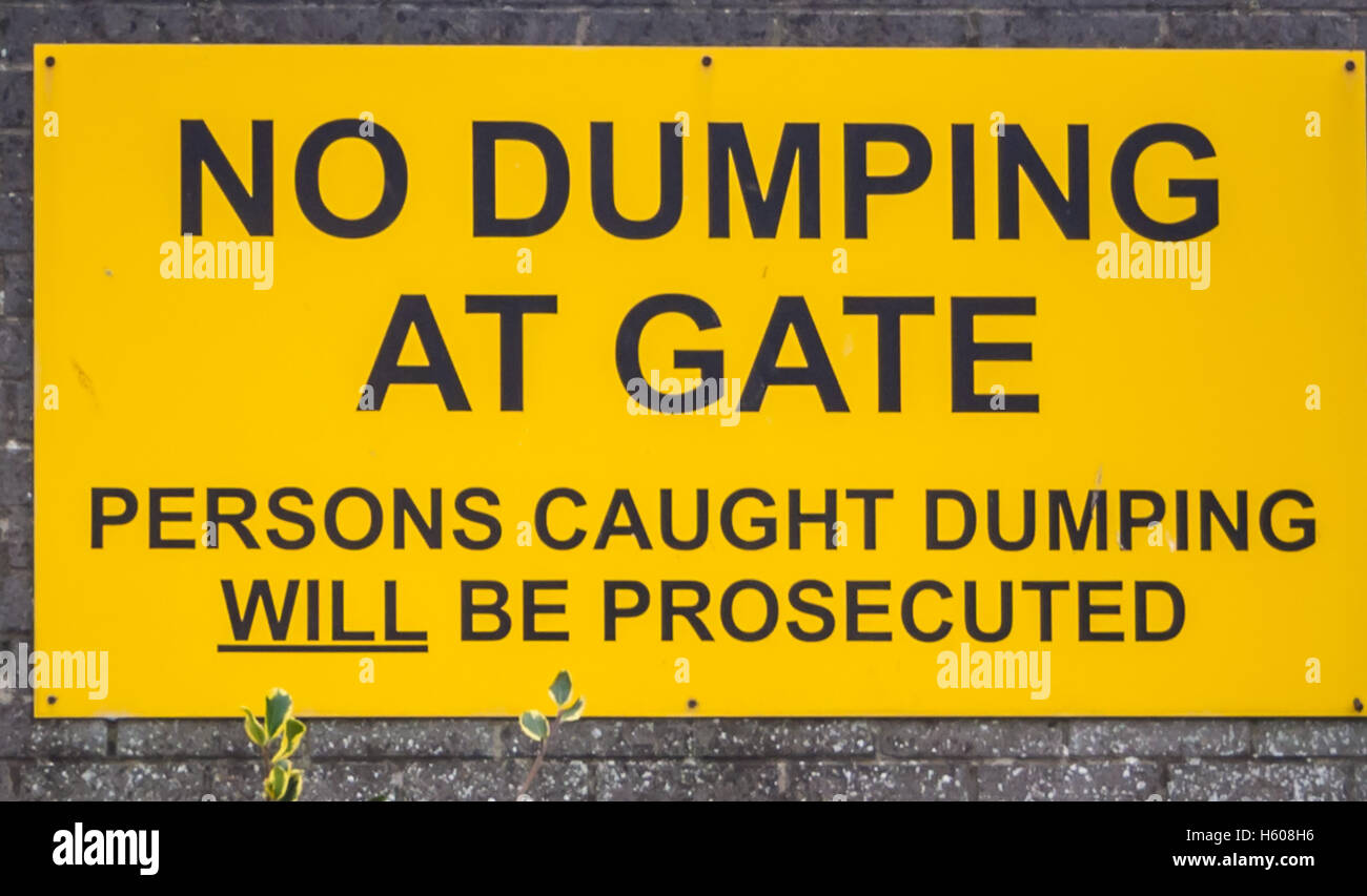 No Dumping at Gate Stock Photo - Alamy