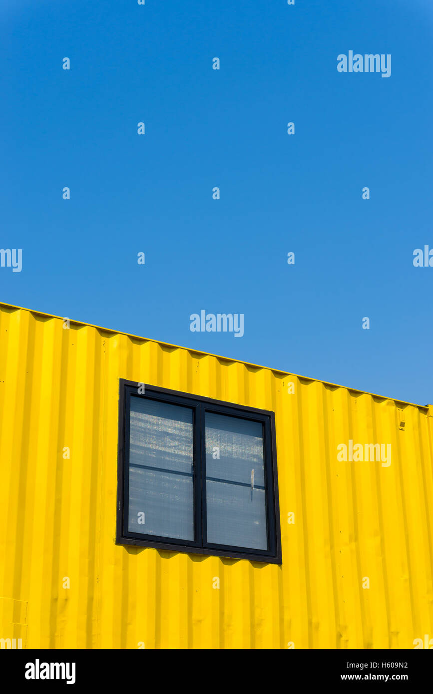 yellow container with background blue sky Stock Photo - Alamy