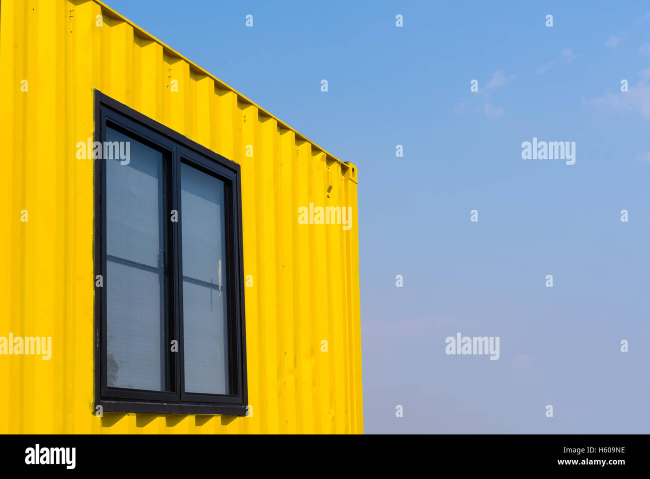 yellow container with background blue sky Stock Photo - Alamy