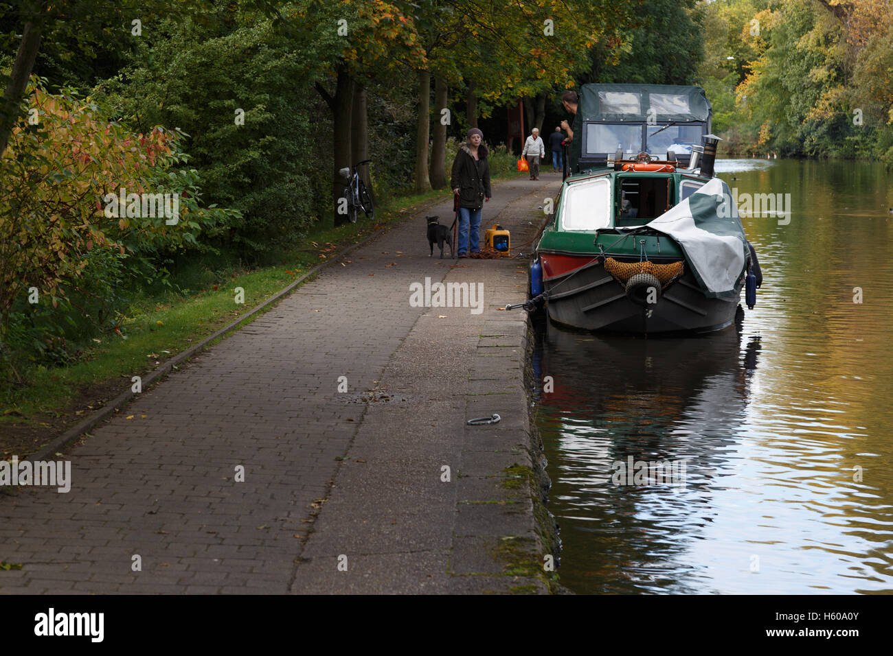 Woman standing by boat on Nottingham canal. In Nottingham, England. On ...