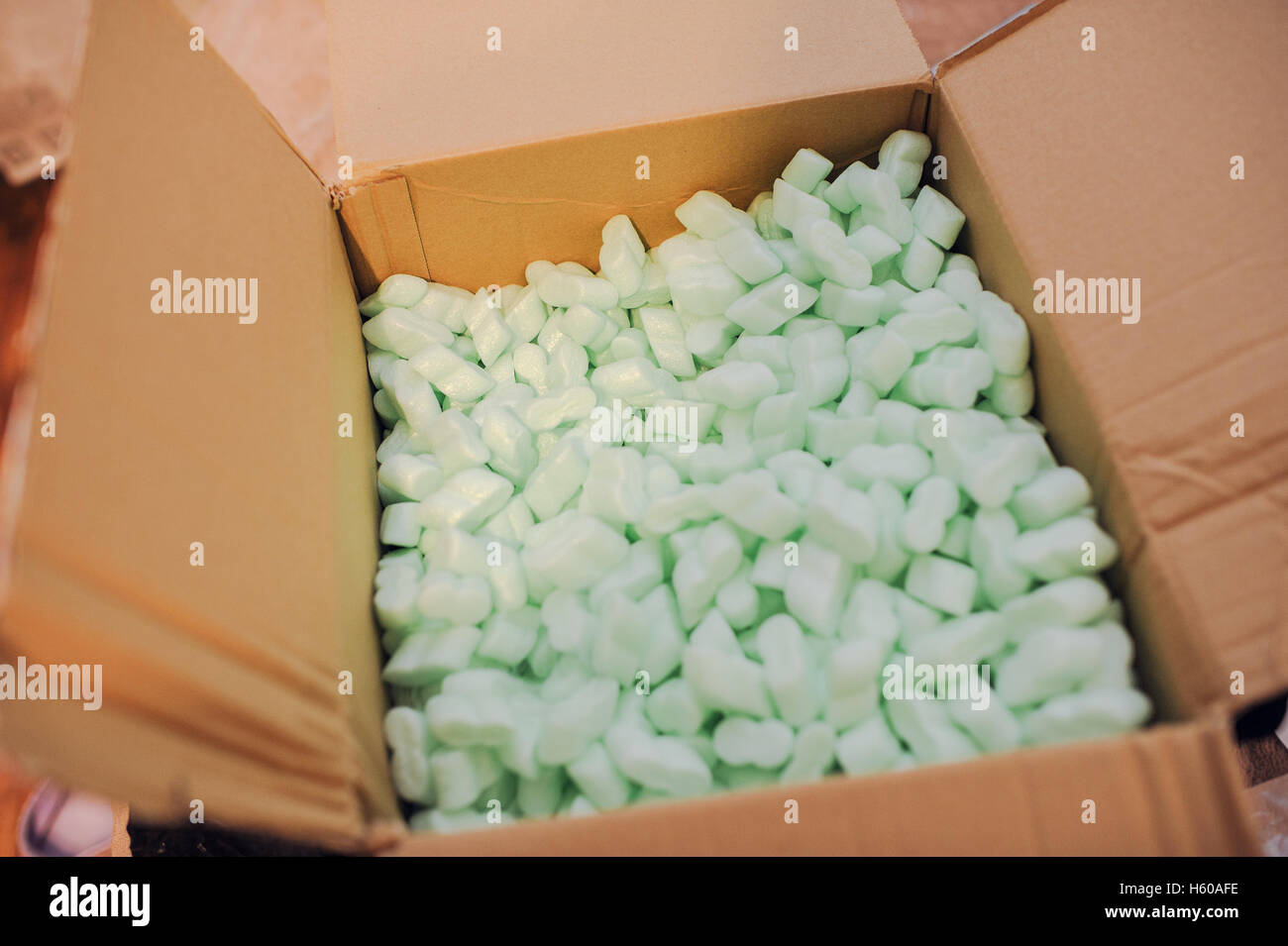 Large packaging box filled with many white styrofoam pellets Stock ...