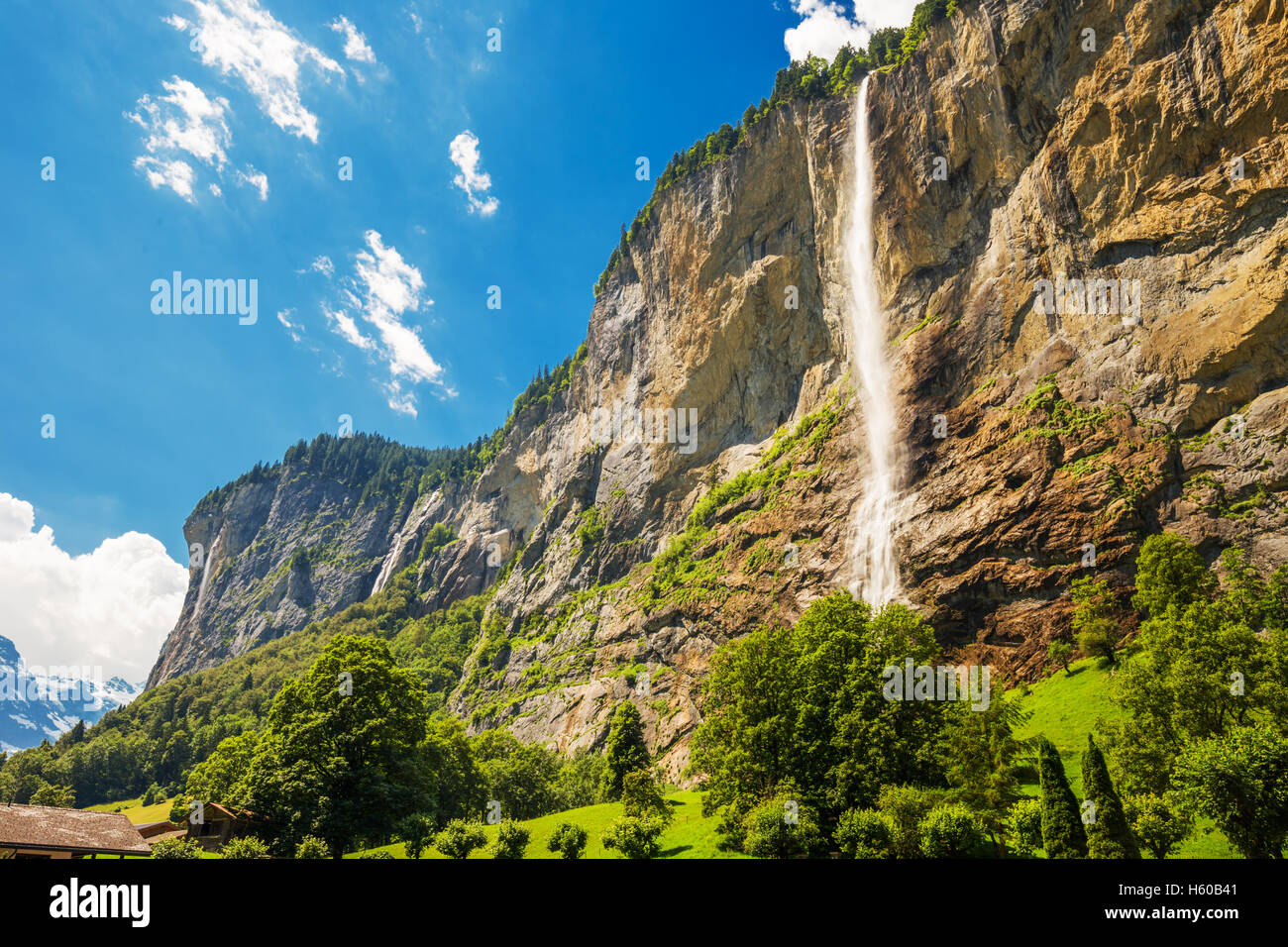 Famous Lauterbrunnen valley with gorgeous waterfall and Swiss Alps in ...