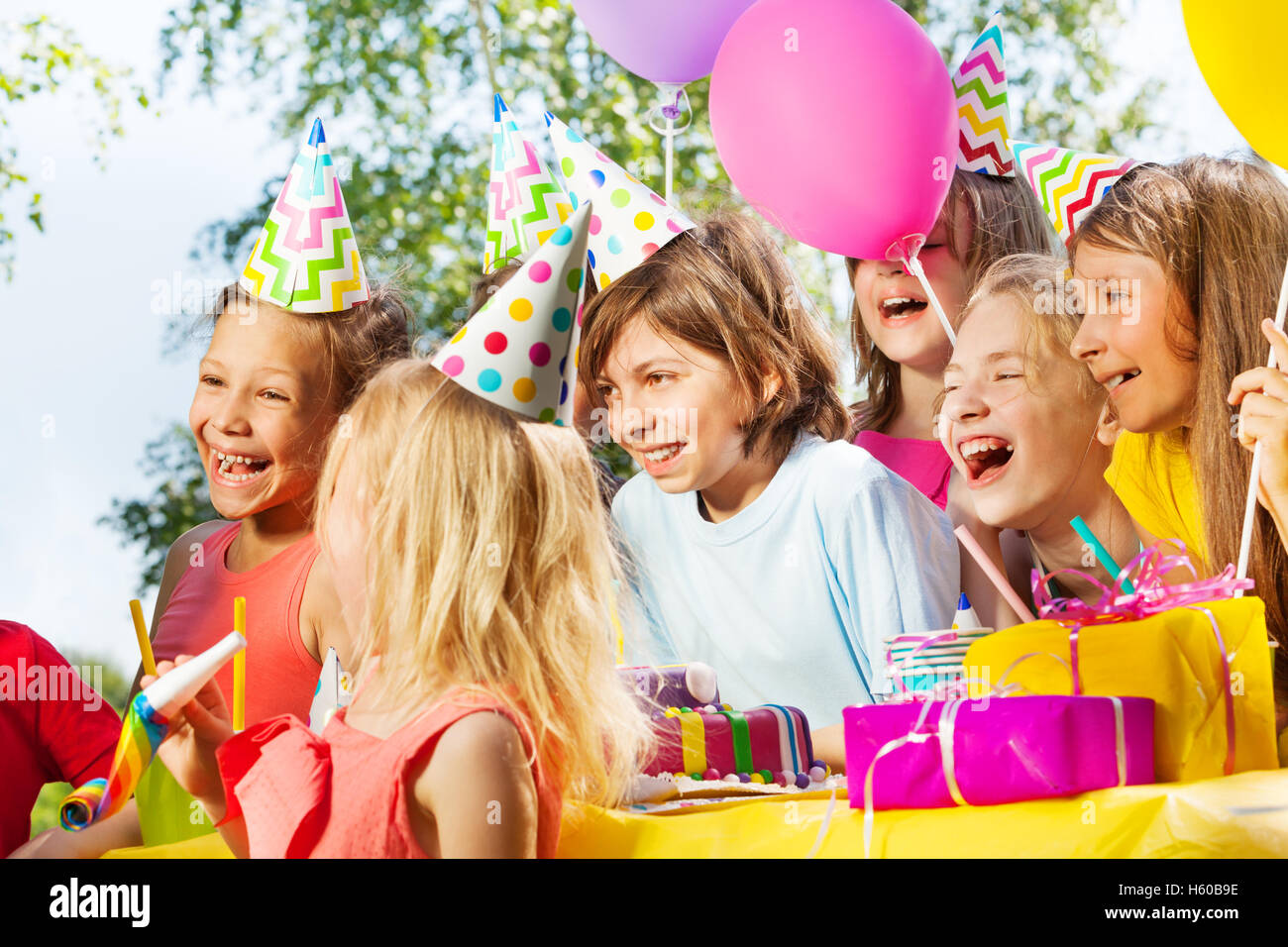 Happy kids having fun at outdoor B-day party Stock Photo - Alamy