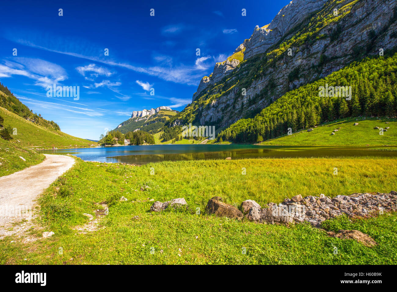 Tourquise clear Seealpsee with the Swiss Alps (mountain Santis) in the ...