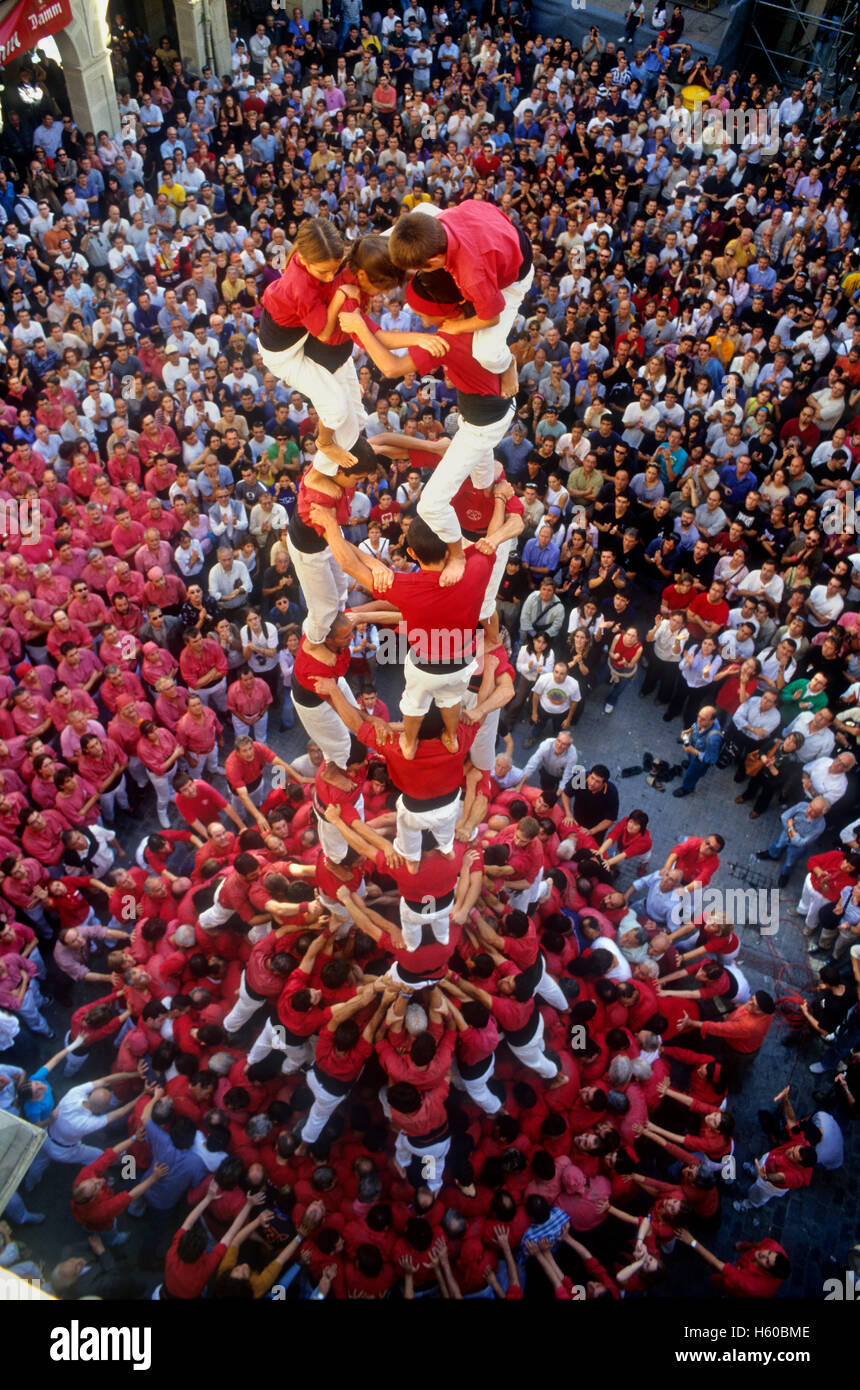Colla Joves Xiquets de Valls. 'Castellers' building human tower, a ...