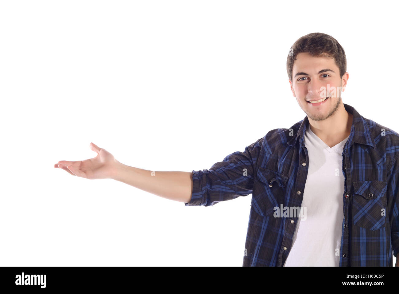 Portrait of a young man showing something on palm. Isolated white ...
