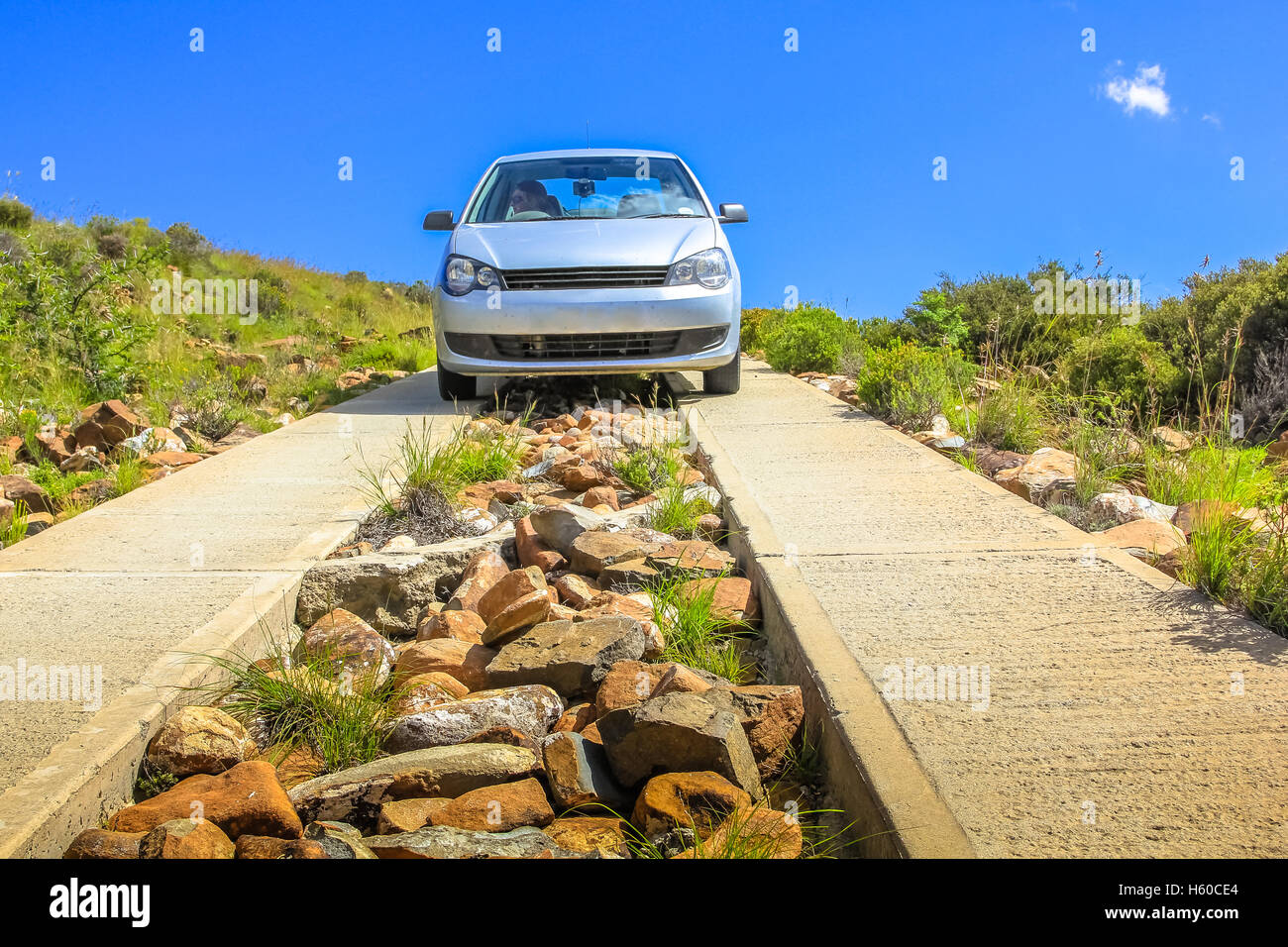 Dangerous road sloping Stock Photo - Alamy