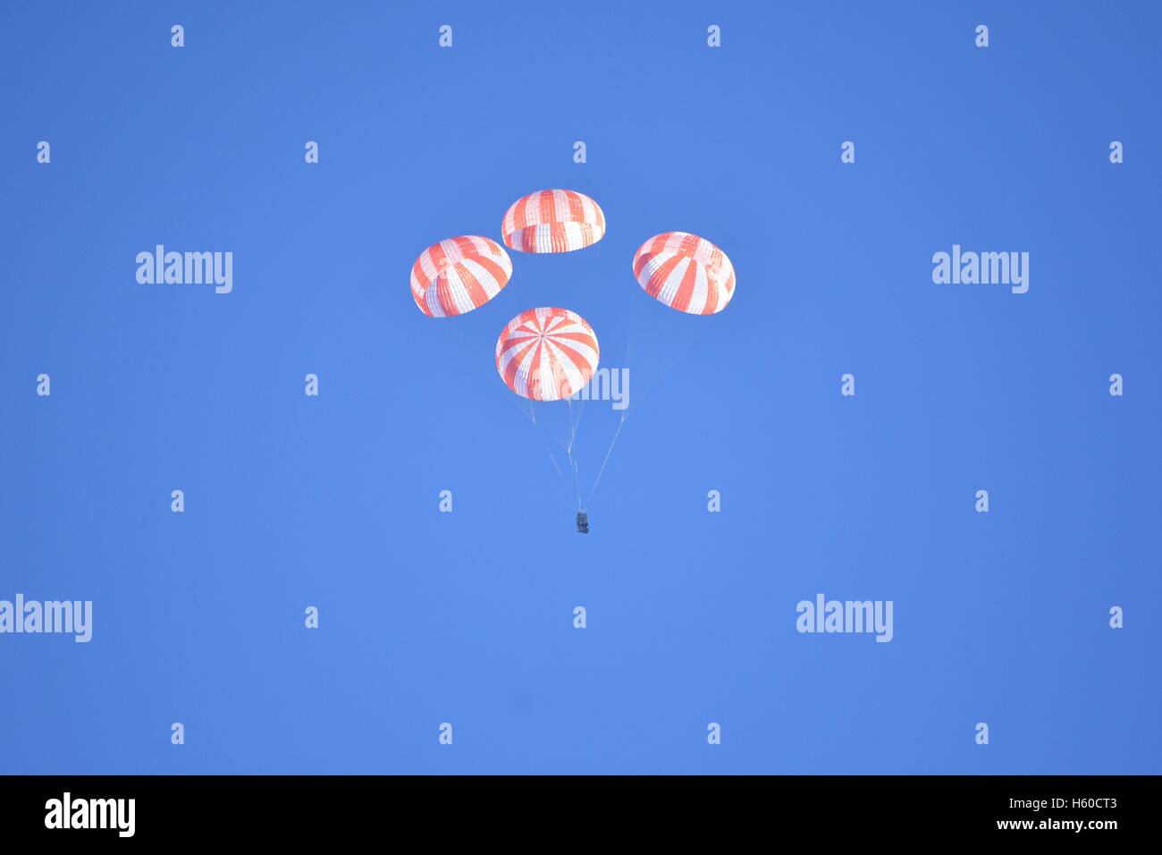 The SpaceX Crew Dragon 2 spacecraft deploys all four parachutes ...