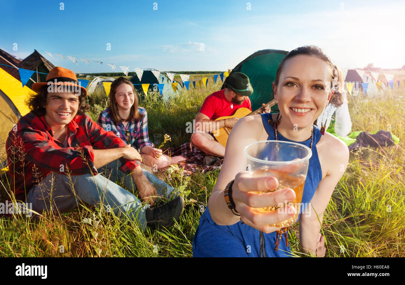 Portrait of pretty young woman toasting with cup Stock Photo - Alamy