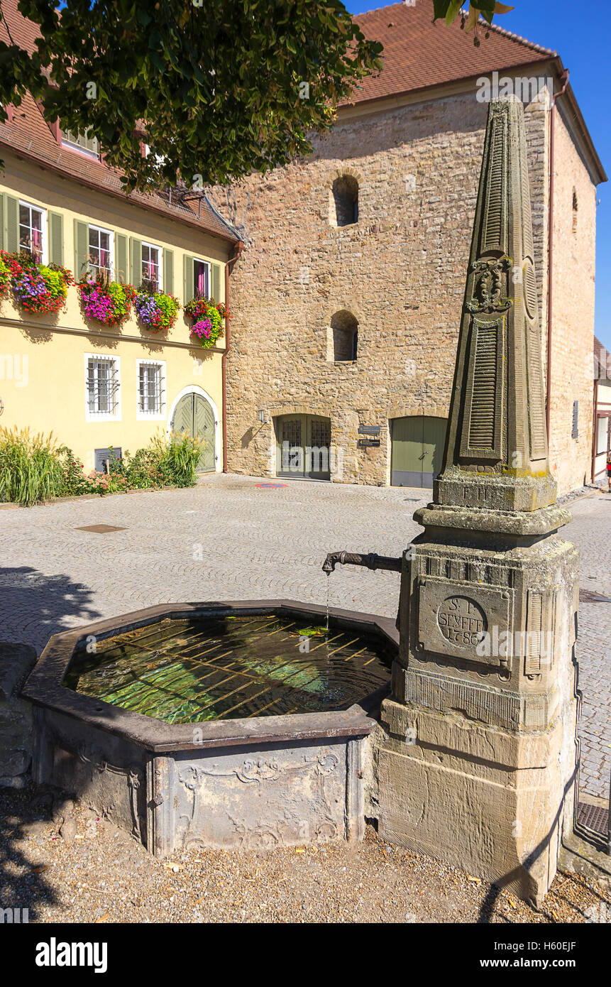 Well in front of the town hall, the historic Grafenburg Castle in ...
