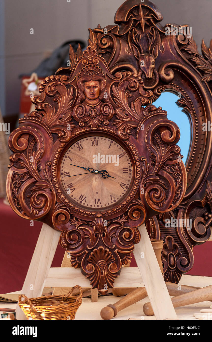 Floral woodwork analogue antique clock. Wooden frame Stock Photo - Alamy