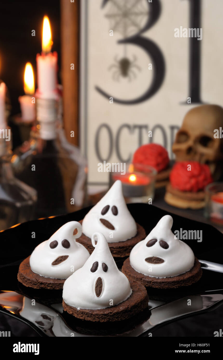 Chocolate biscuits decorated with meringue as a ghost for Halloween ...