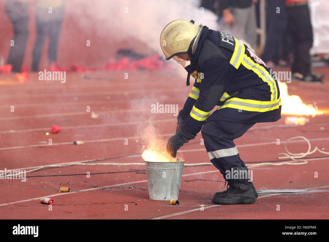 Sofia, Bulgaria - October 15, 2016: Firefighter is putting down ...