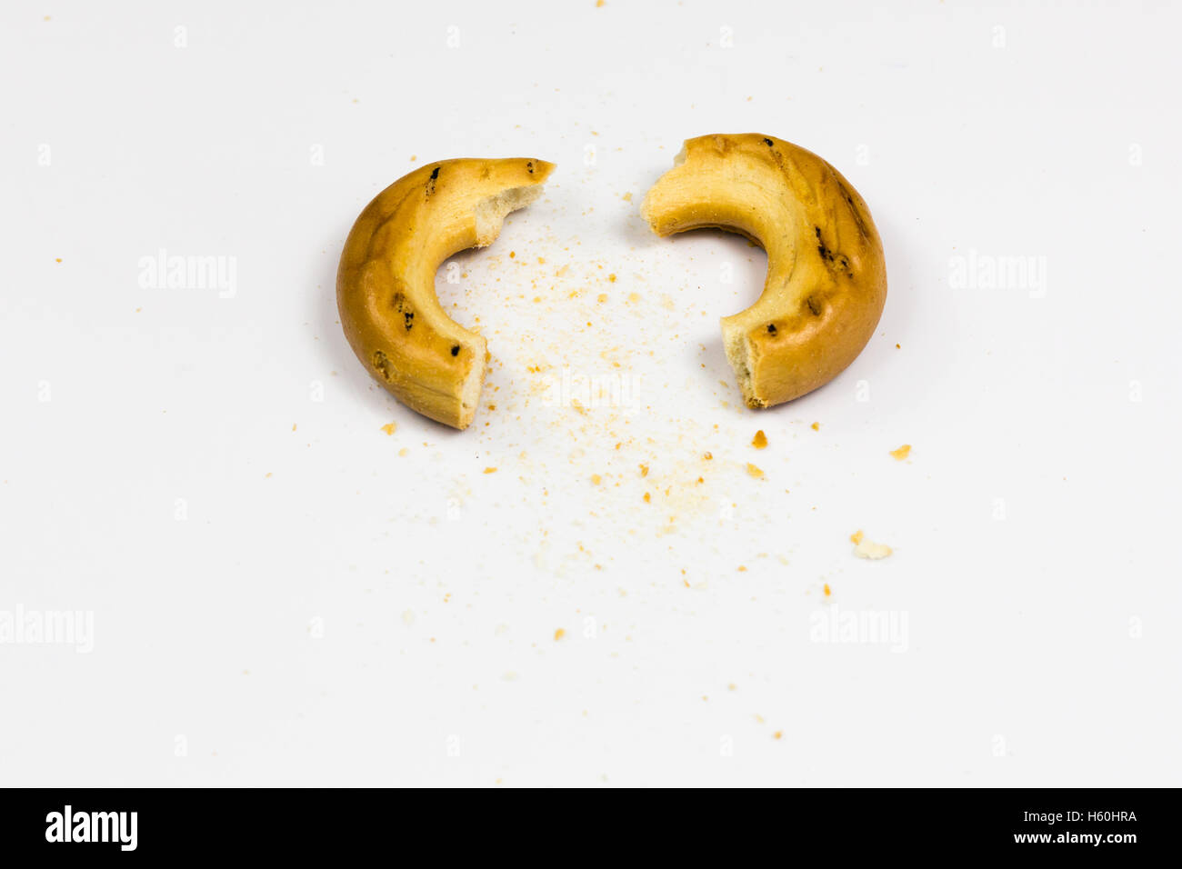 Broken pretzel with breadcrumbs Stock Photo - Alamy
