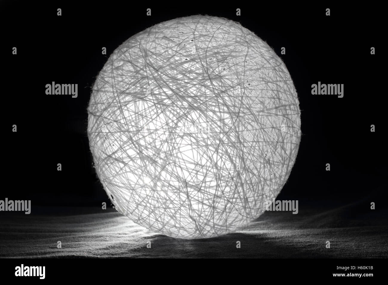 The globe made of white threads glowing on the dark background Stock ...