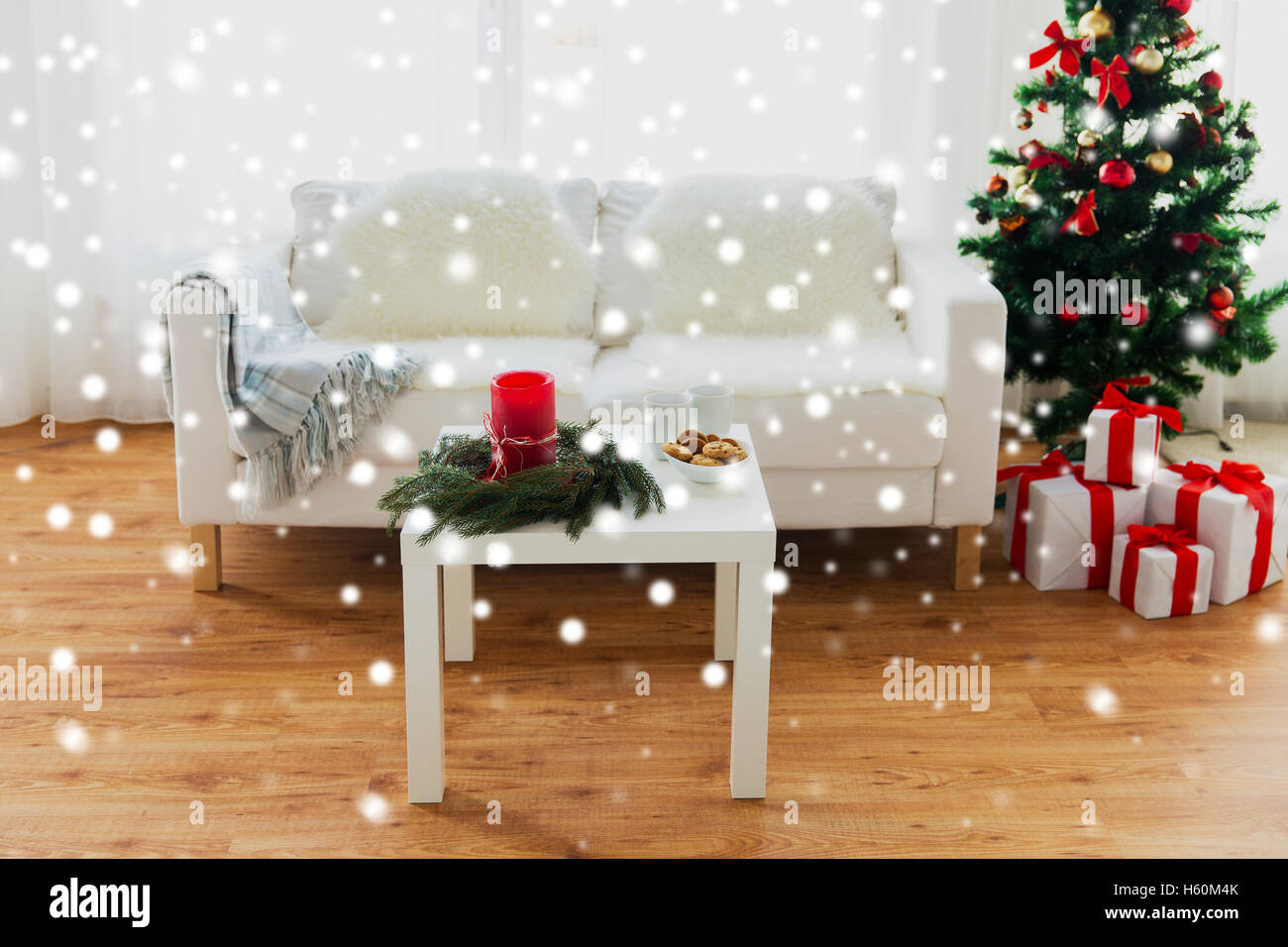 sofa, table and christmas tree with gifts at home Stock Photo - Alamy