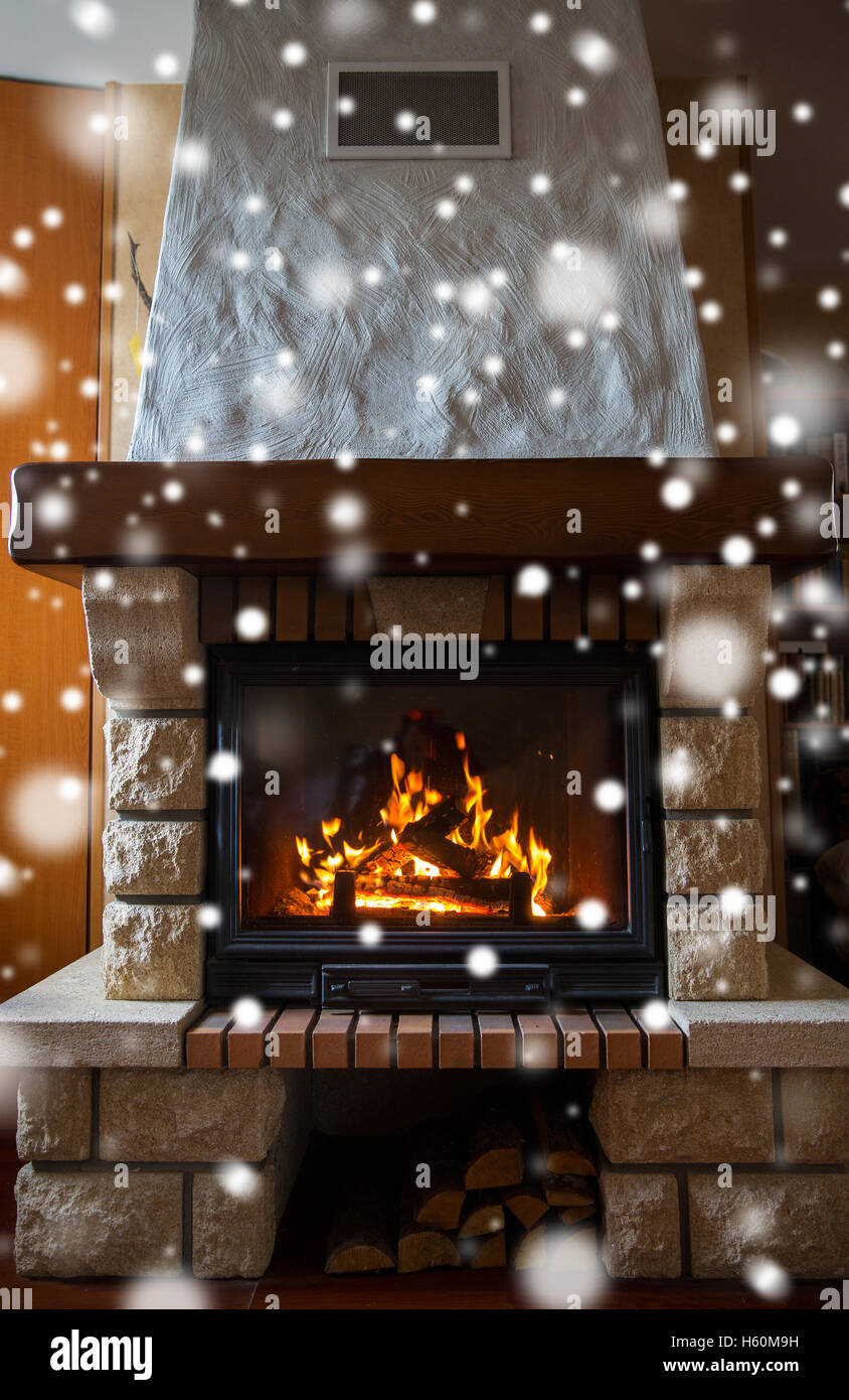 close up of burning fireplace with snow Stock Photo - Alamy