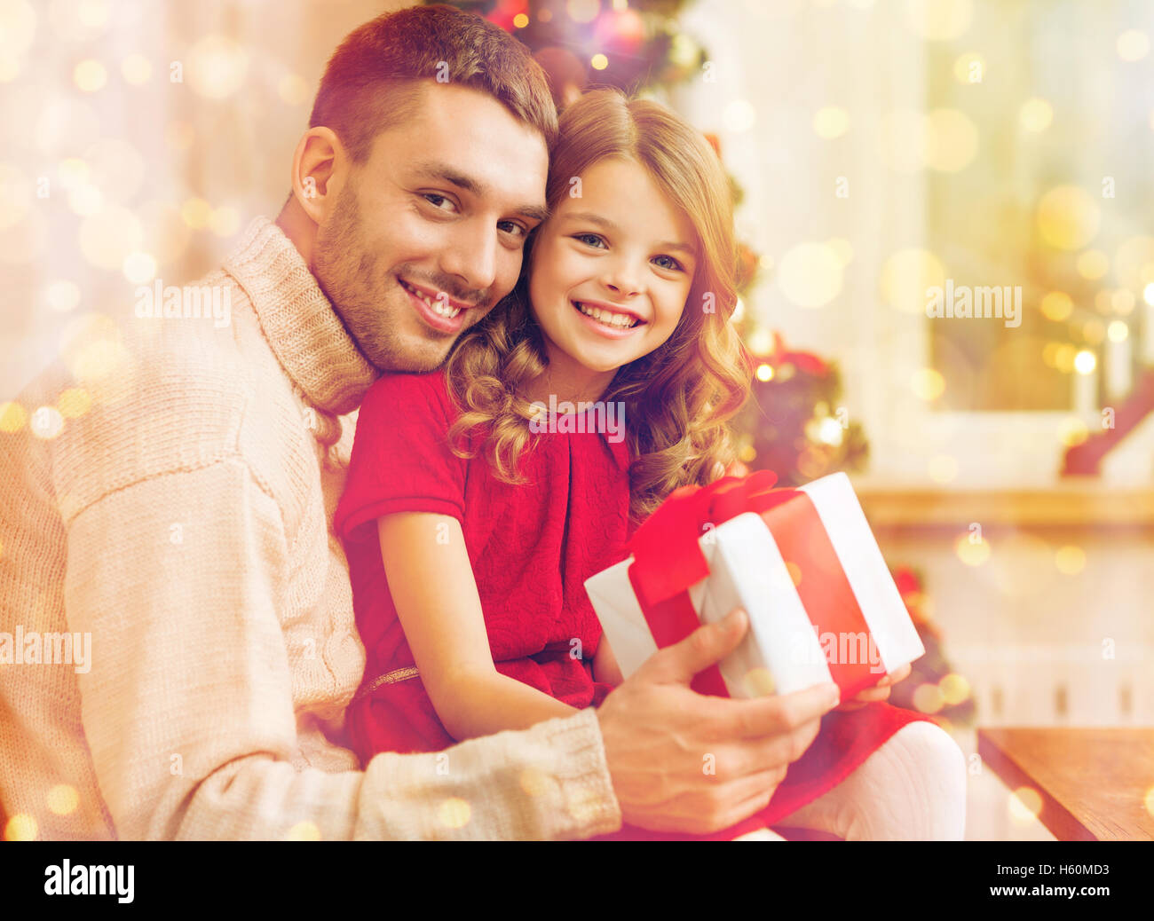 smiling father and daughter holding gift box Stock Photo - Alamy