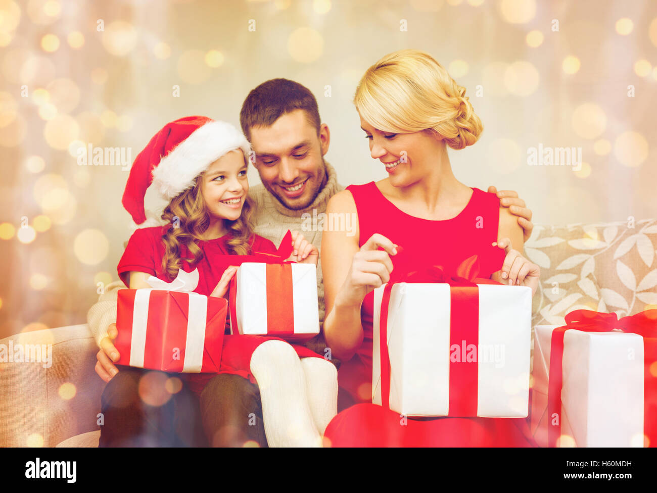 happy family opening gift boxes Stock Photo - Alamy