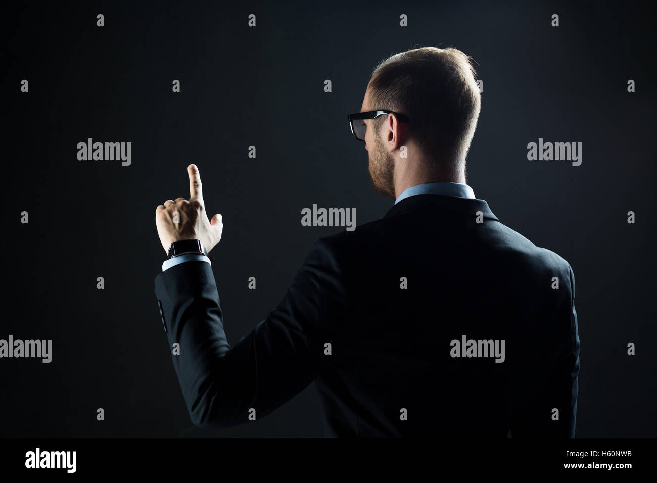 businessman pointing finger to something invisible Stock Photo - Alamy
