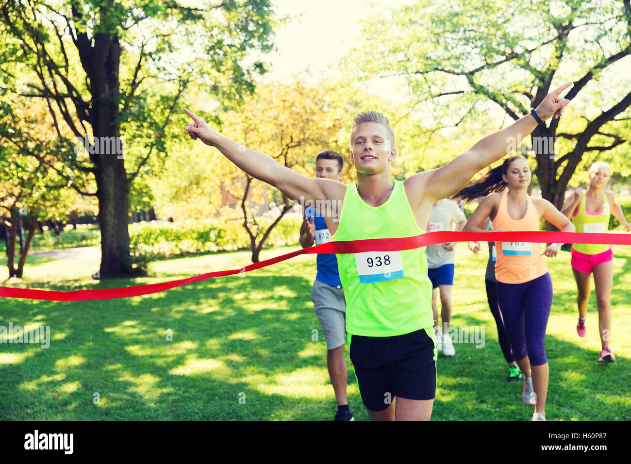 happy young male runner winning on race finish Stock Photo - Alamy