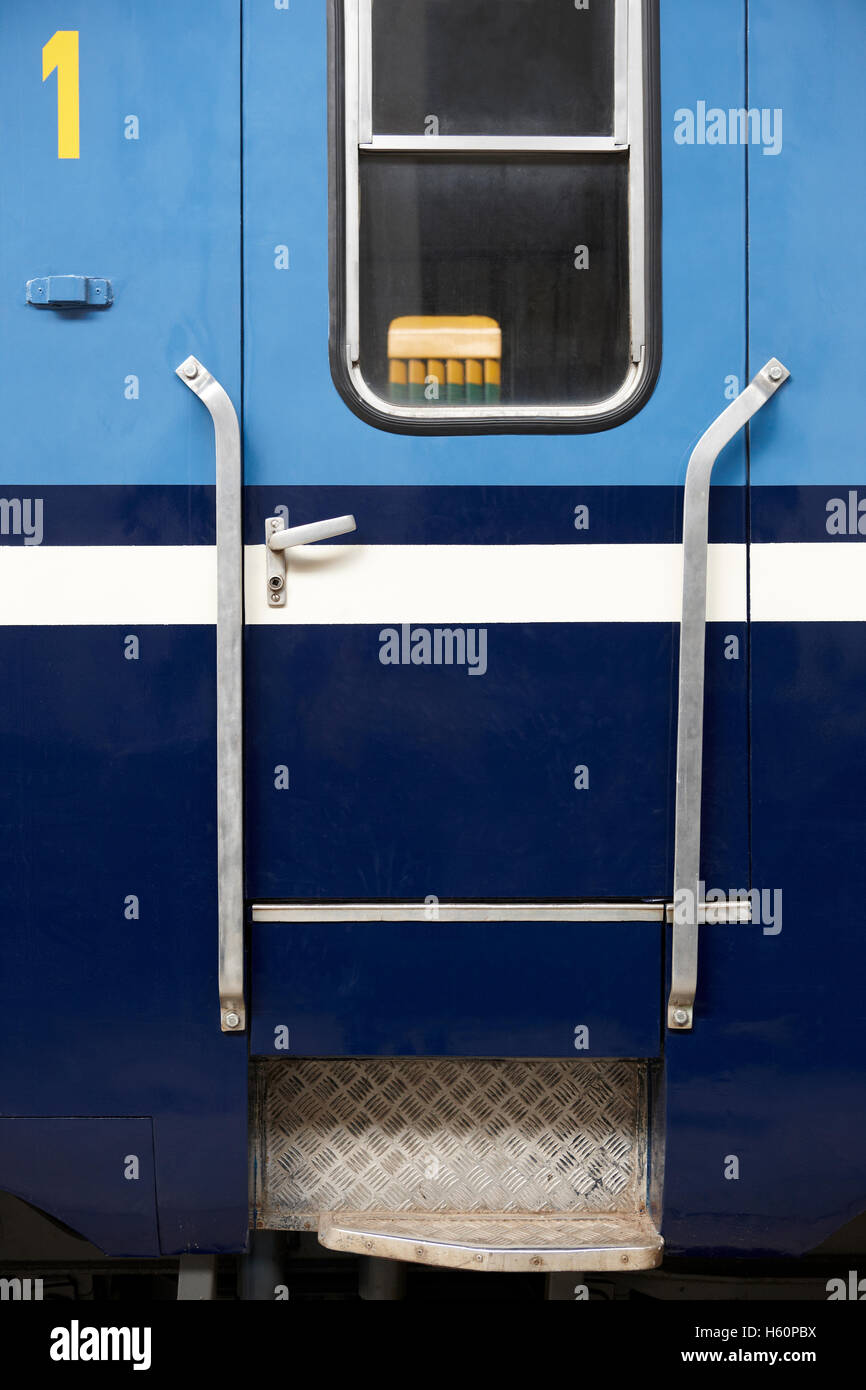 Blue train wagon entrance door in a railway station. Vertical Stock ...
