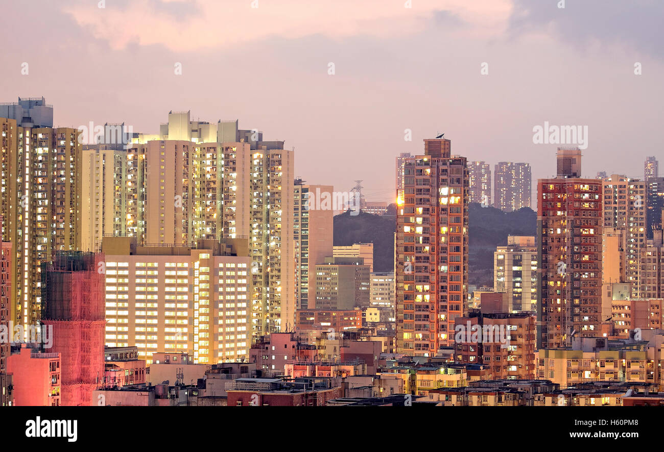 urban city at sunset with all lights lit up Stock Photo - Alamy