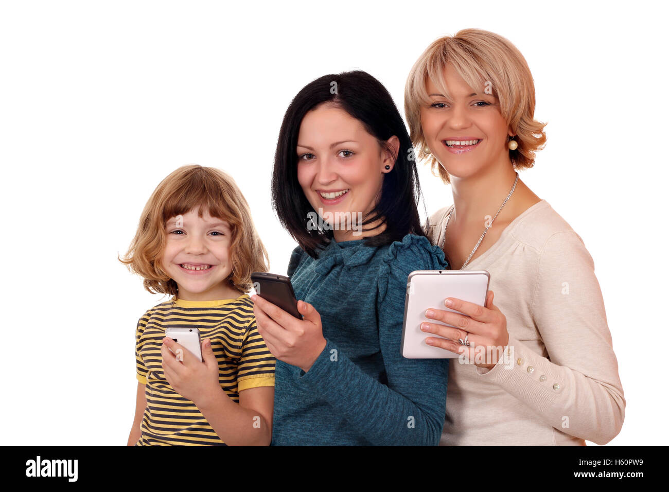 three generation little girl teenage girl and woman with tablet and ...
