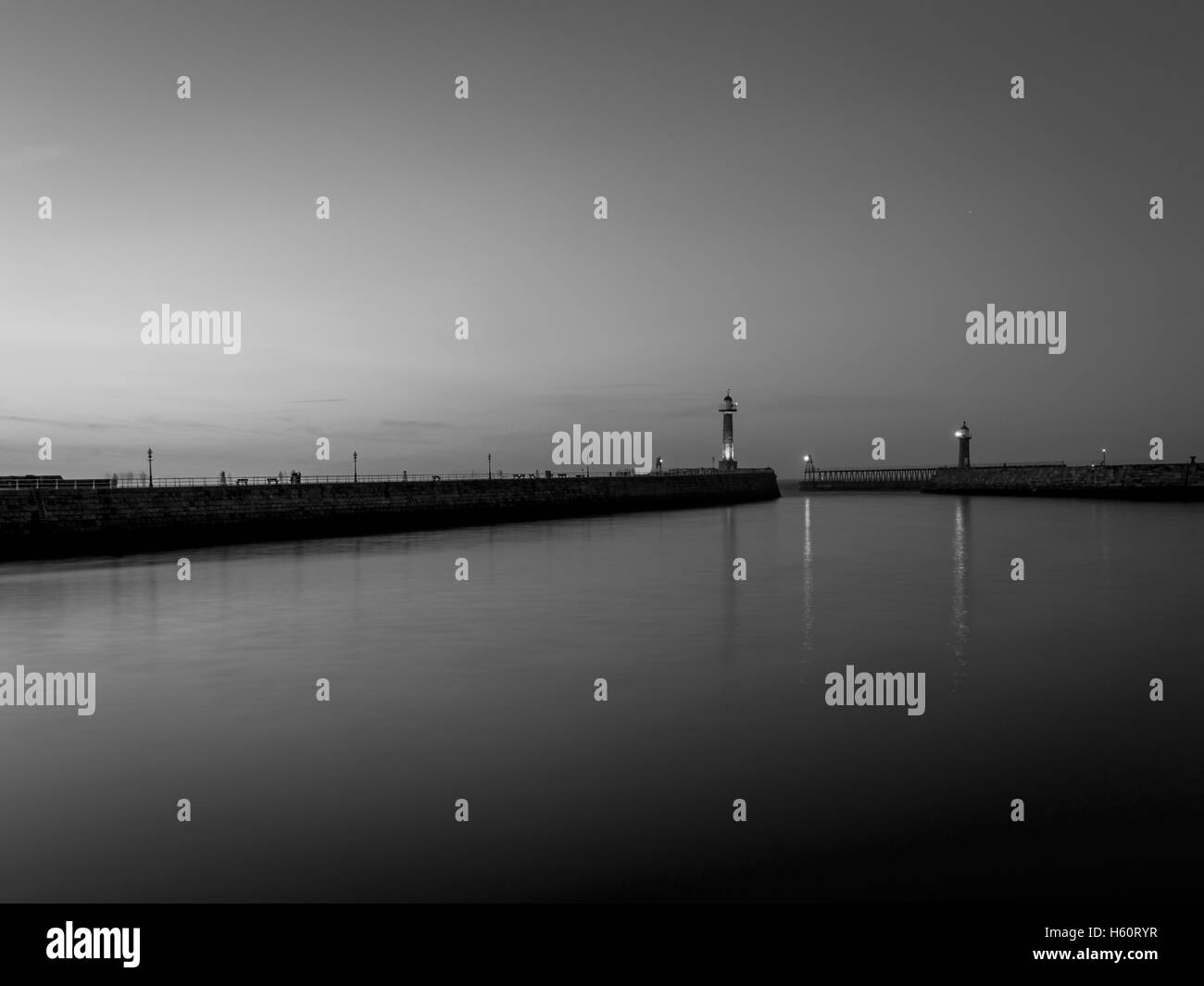 Monochrome Whitby Harbour and Its Twin Piers and Lighthouses taken at ...