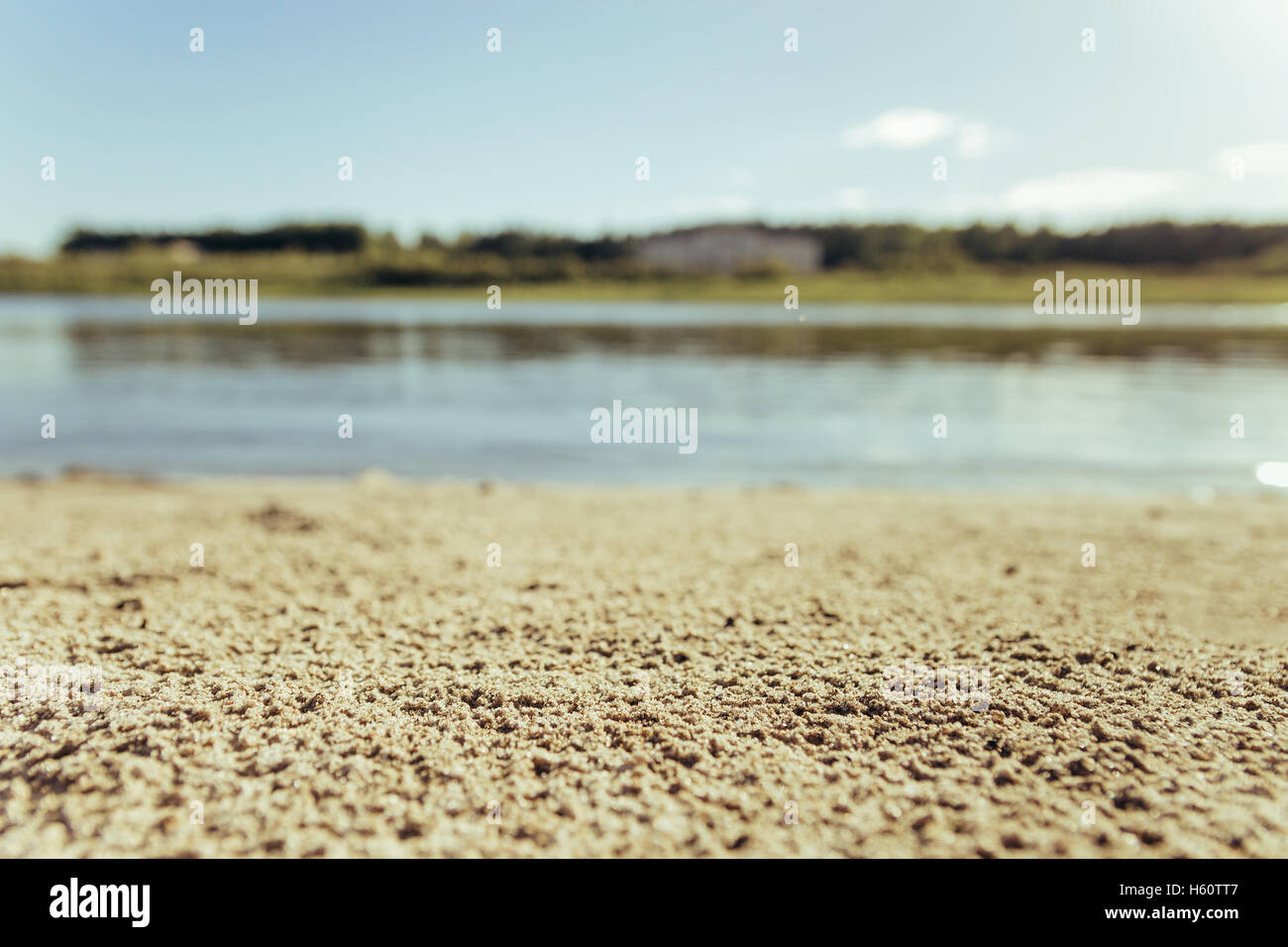 Sand on beach and river water Stock Photo - Alamy