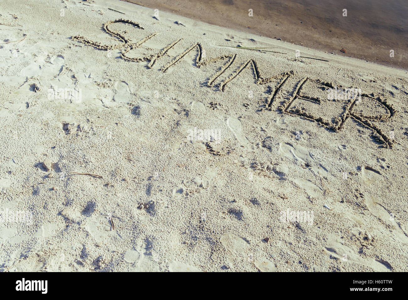 Sand on beach and river water Stock Photo - Alamy