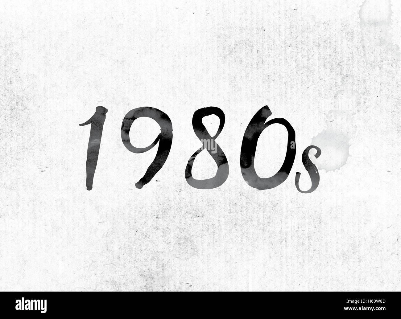 The word "1980s" concept and theme painted in watercolor ink on a white ...