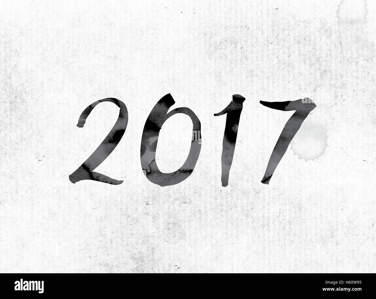 The word "2017" concept and theme painted in watercolor ink on a white ...