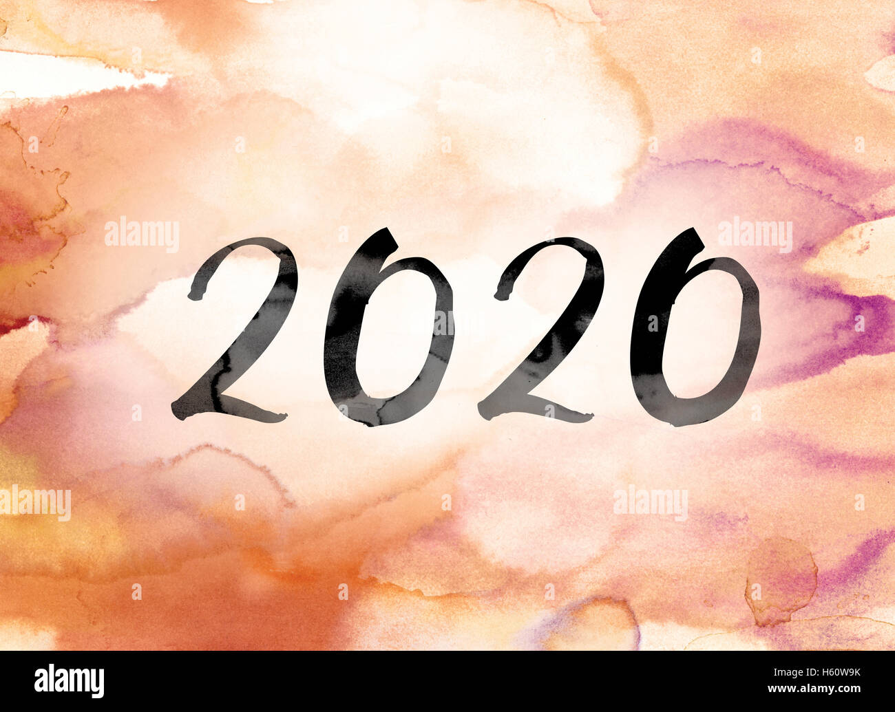 The word "2020" painted in black ink over a colorful watercolor washed ...