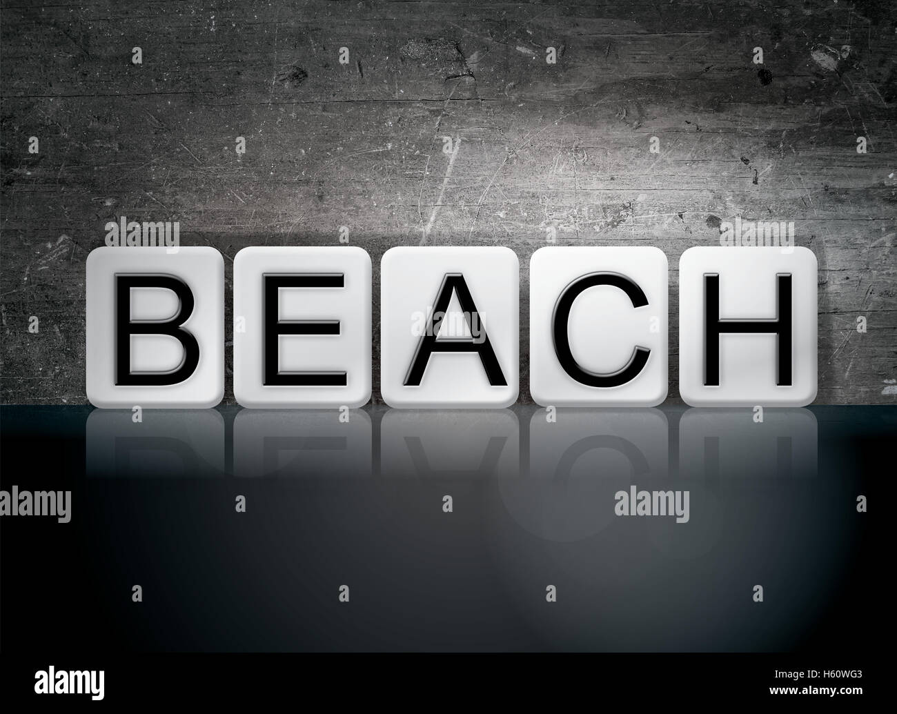 The word "Beach" written in white tiles against a dark vintage grunge ...