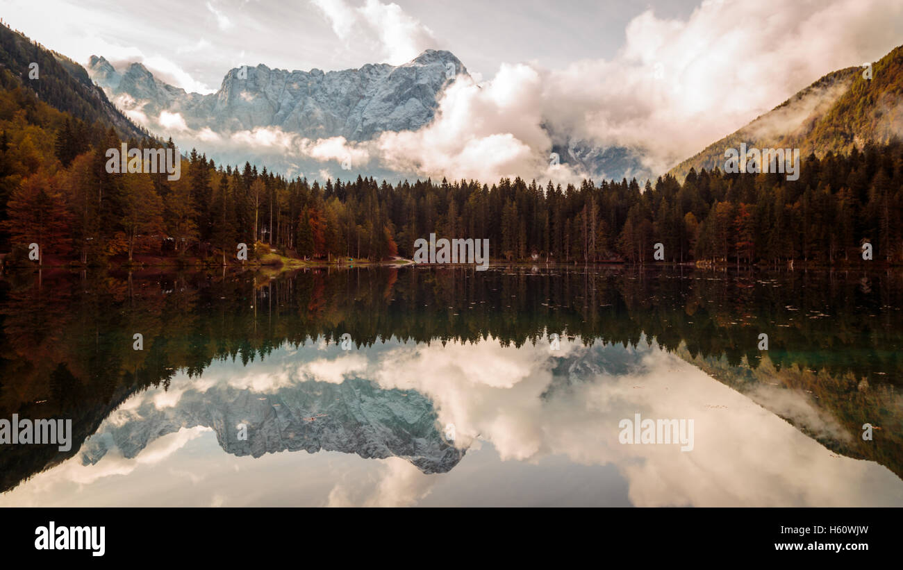 Fall in the italian alps in a misty day Stock Photo - Alamy