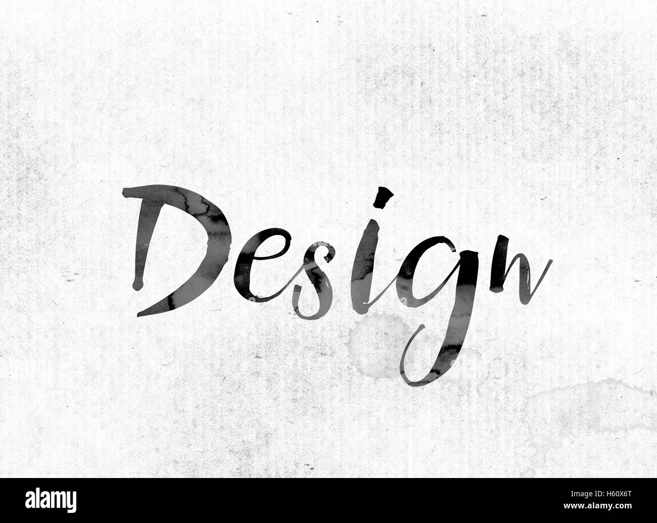 The word "Design" concept and theme painted in watercolor ink on a ...