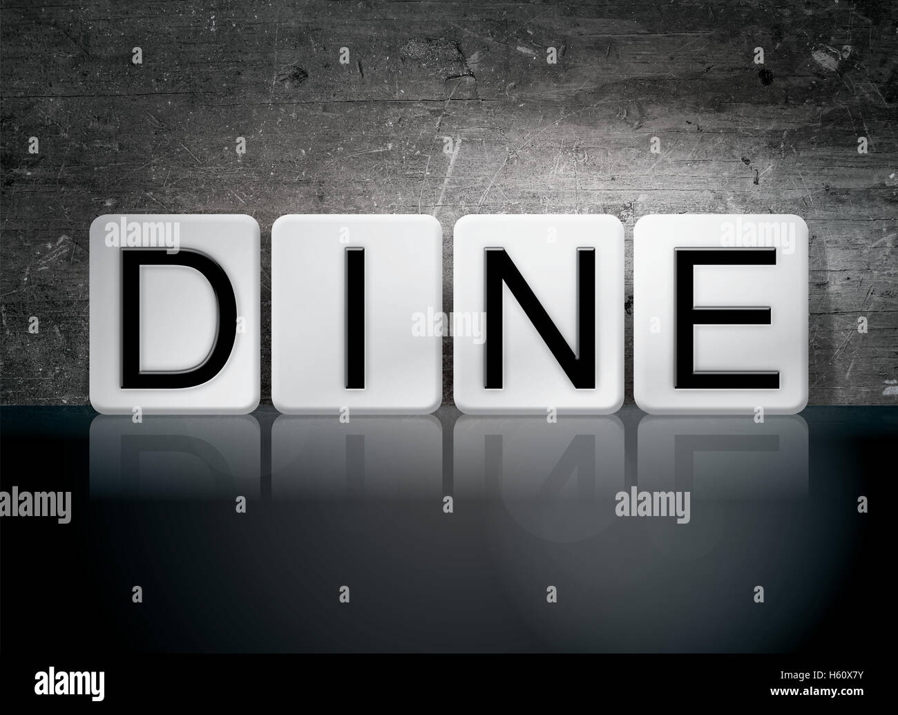 The word "Dine" written in white tiles against a dark vintage grunge ...
