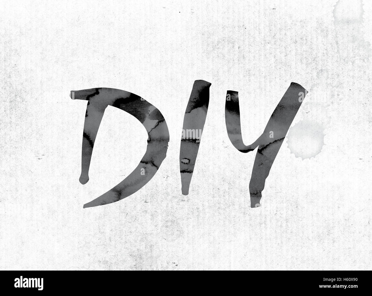 The word "DIY" concept and theme painted in watercolor ink on a white ...